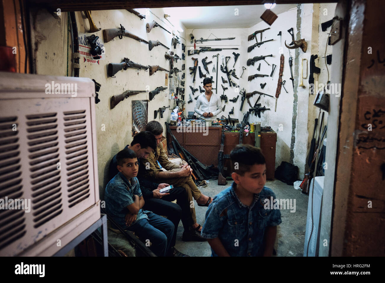 A young Gunsmith in his workshop ithe the centre of Erbil, Kurdistan ...