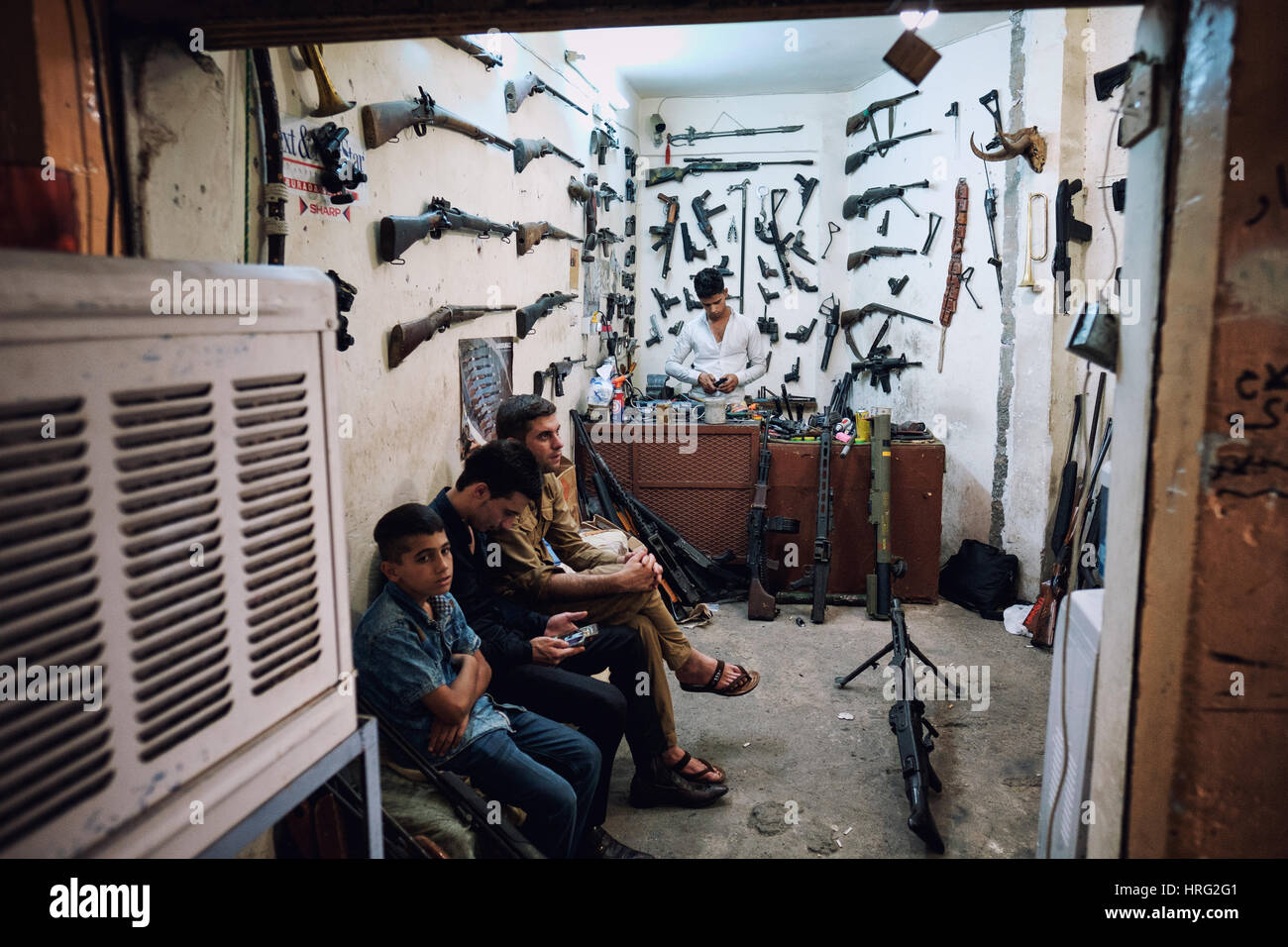A young Gunsmith in his workshop ithe the centre of Erbil, Kurdistan ...