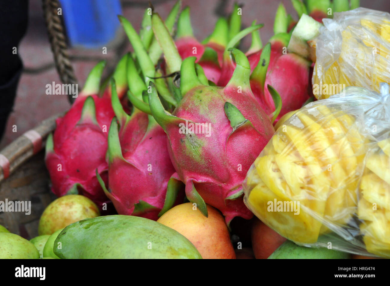 Basket full with exotic fruits in a market. Vietnam Stock Photo - Alamy