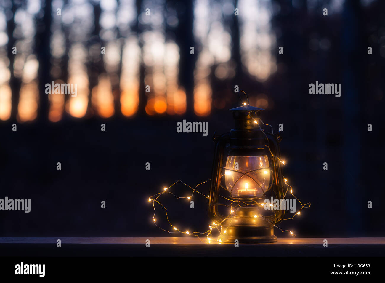 Vintage lamp with a candle and lights at night Stock Photo - Alamy