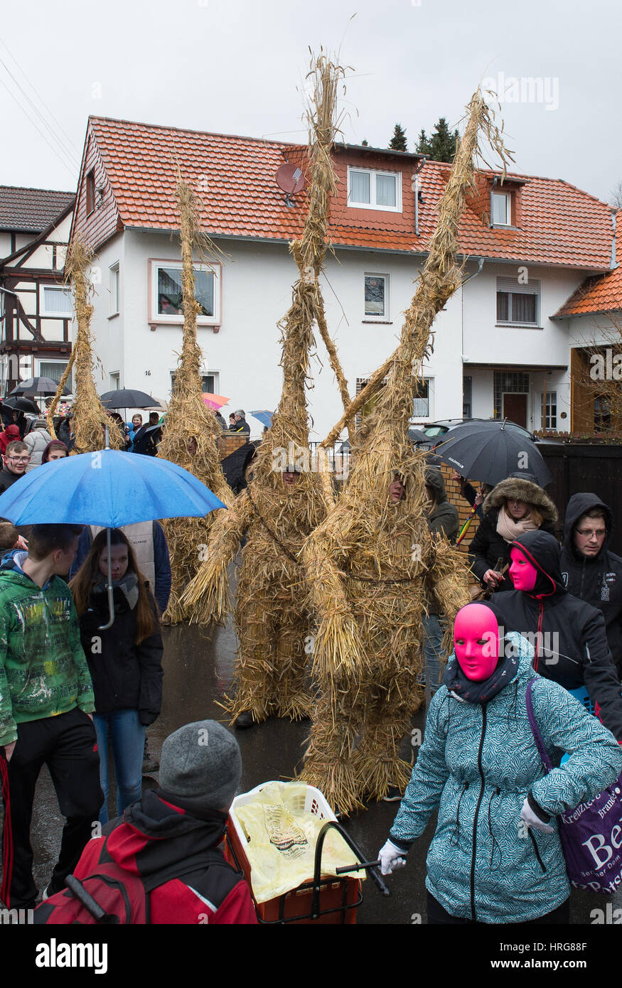 Heldra, Germany. 1st March 2017. People carrying straw bears on the ...