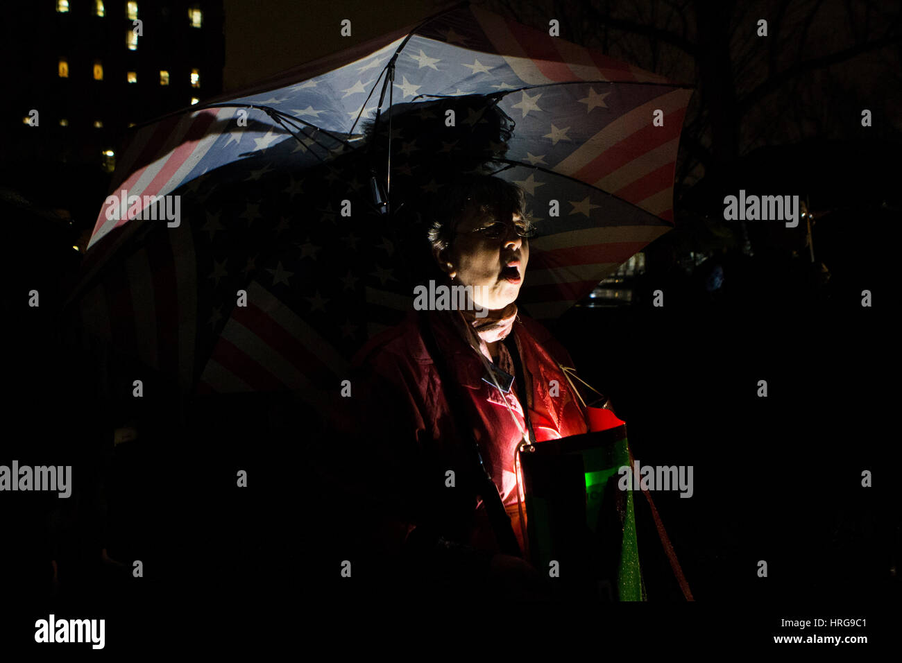 Woman holds sign during protest hi-res stock photography and images - Alamy