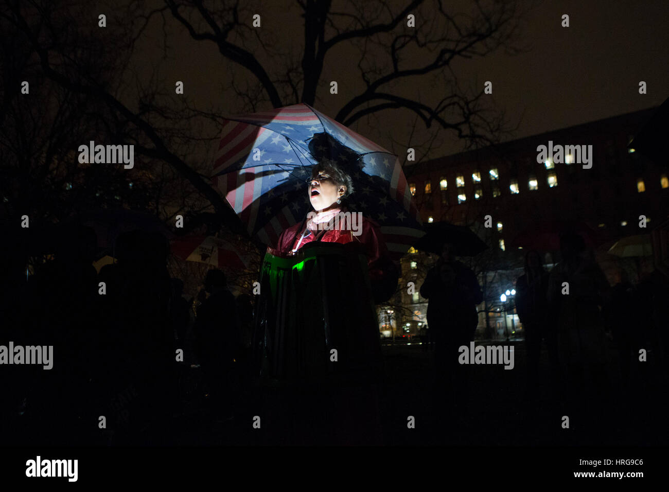 Woman holds sign during protest hi-res stock photography and images - Alamy