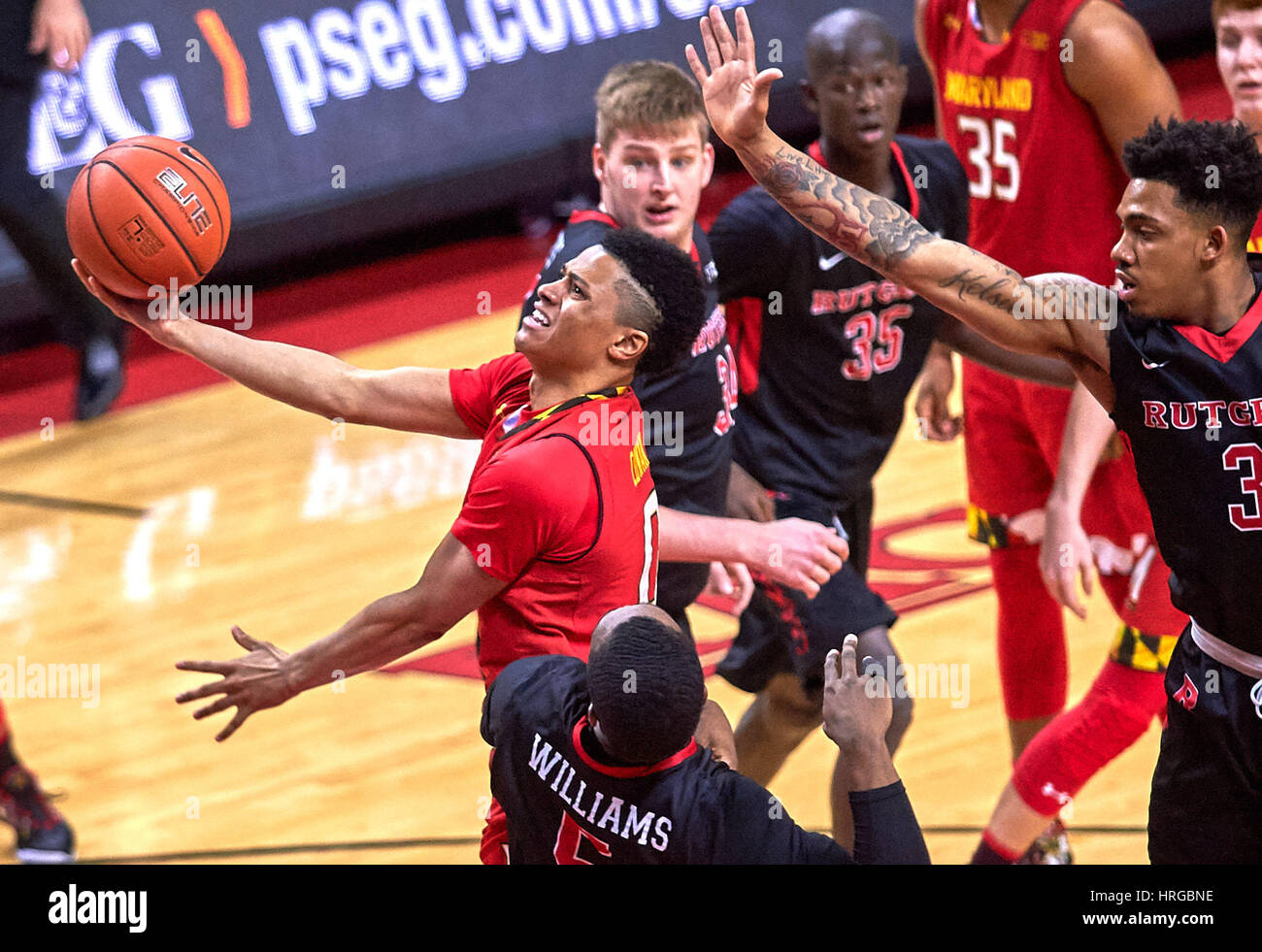 Maryland's guard Anthony Cowen (0) scoops in a shot by Rutgers ...