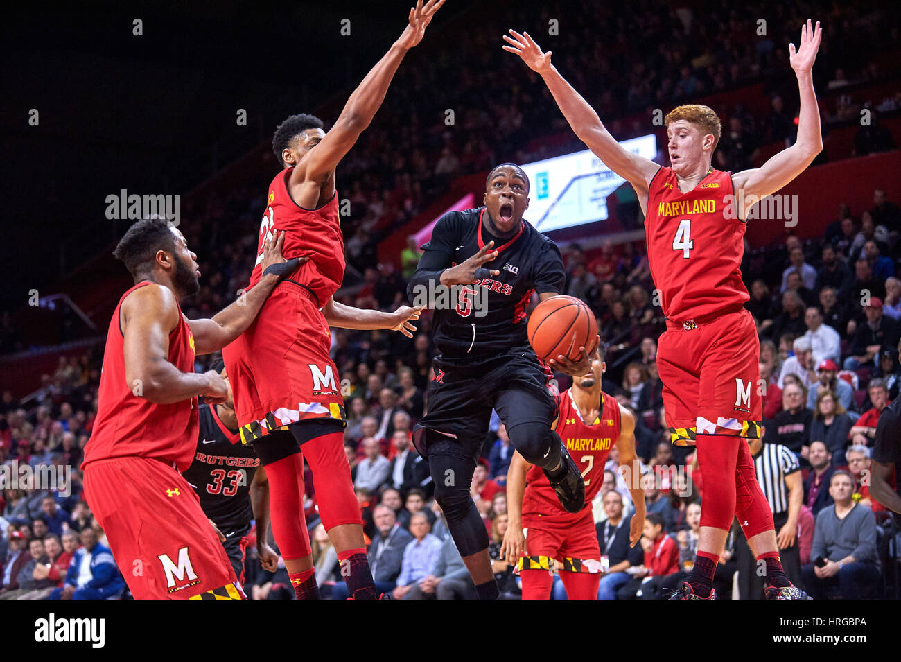Rutgers' guard Mike Williams (5) drives to the basket past Maryland's ...
