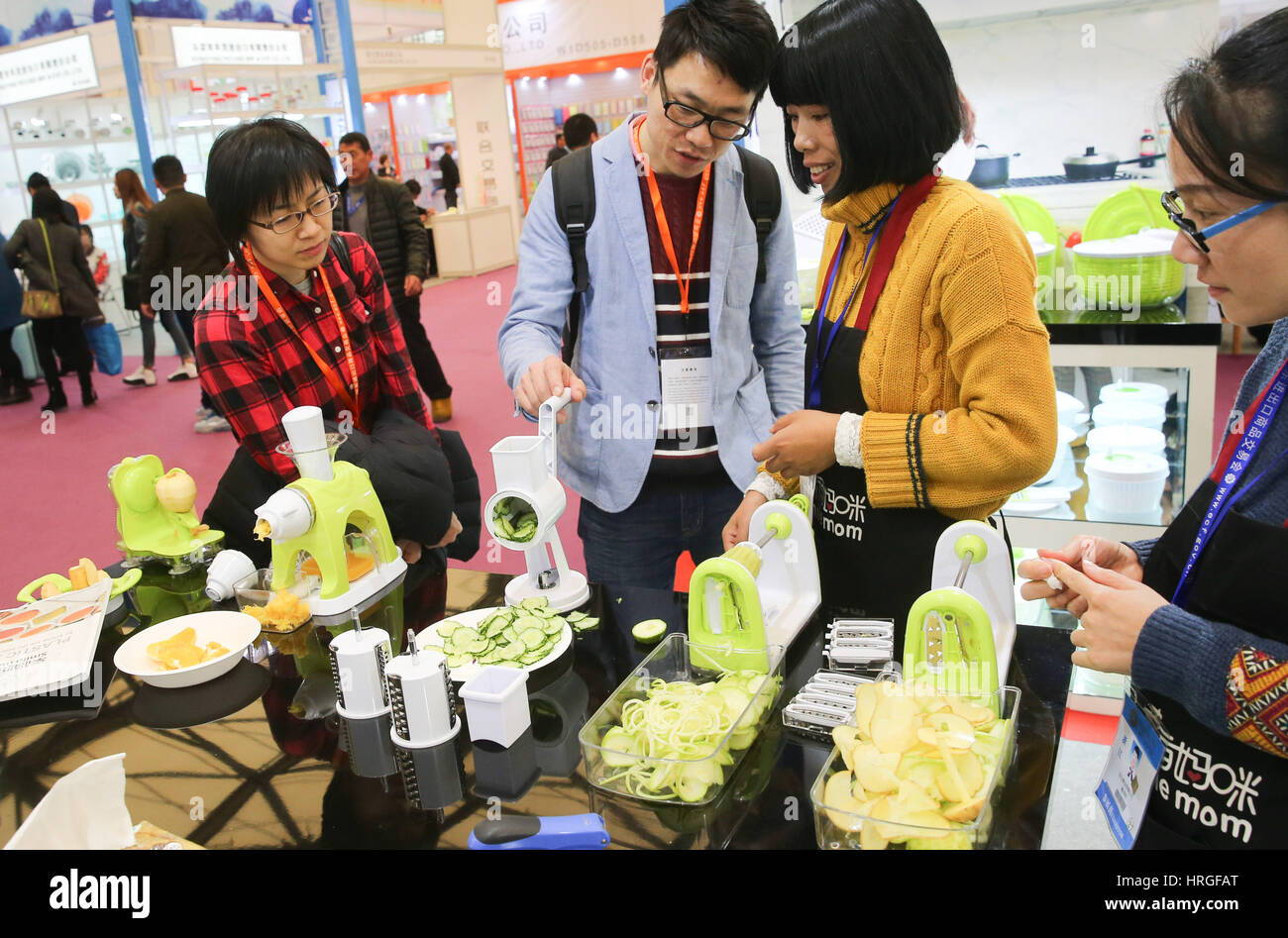 Shanghai, China. 2nd Mar, 2017. An exhibitor introduces food processors ...