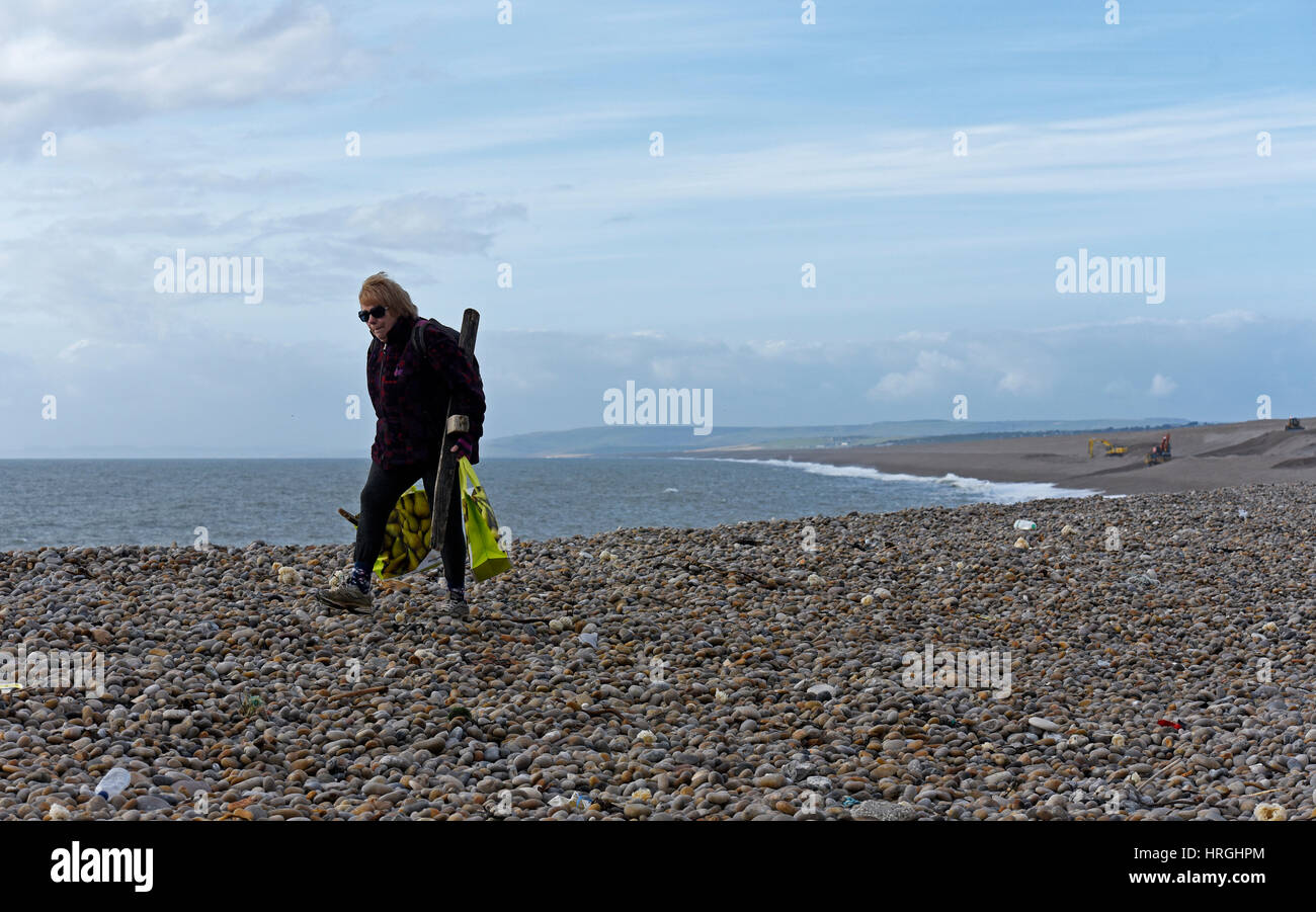 Portland, Dorset, UK. 2nd Mar, 2017. UK Weather. Beach combers scavenge ...