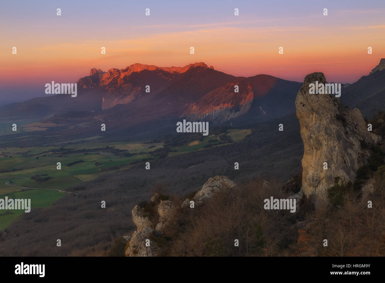 First sun rays on the mountain Stock Photo - Alamy