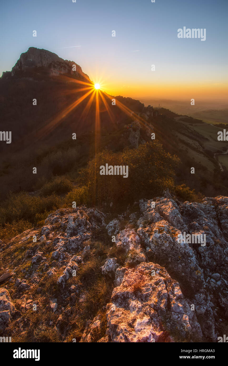 First sun rays on the mountain Stock Photo - Alamy