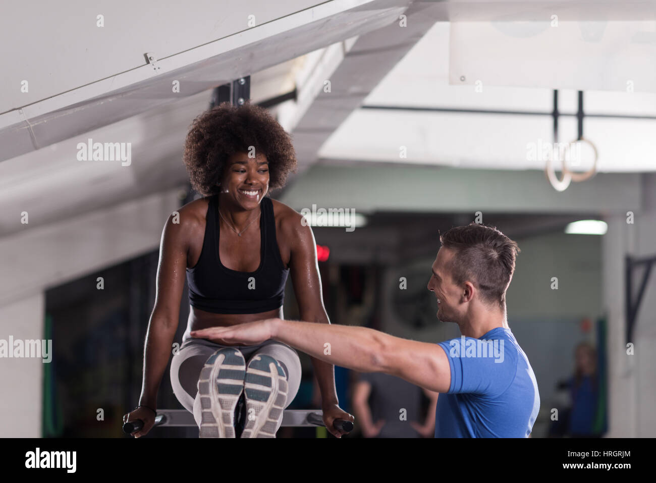 african american athlete woman workout out arms on dips horizontal ...