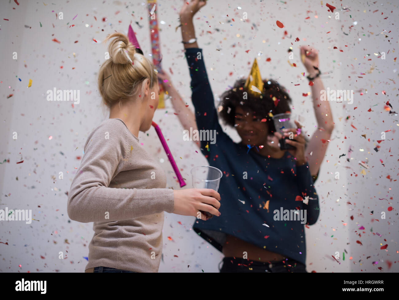 confetti party Multiethnics happy young people group celebrating new ...