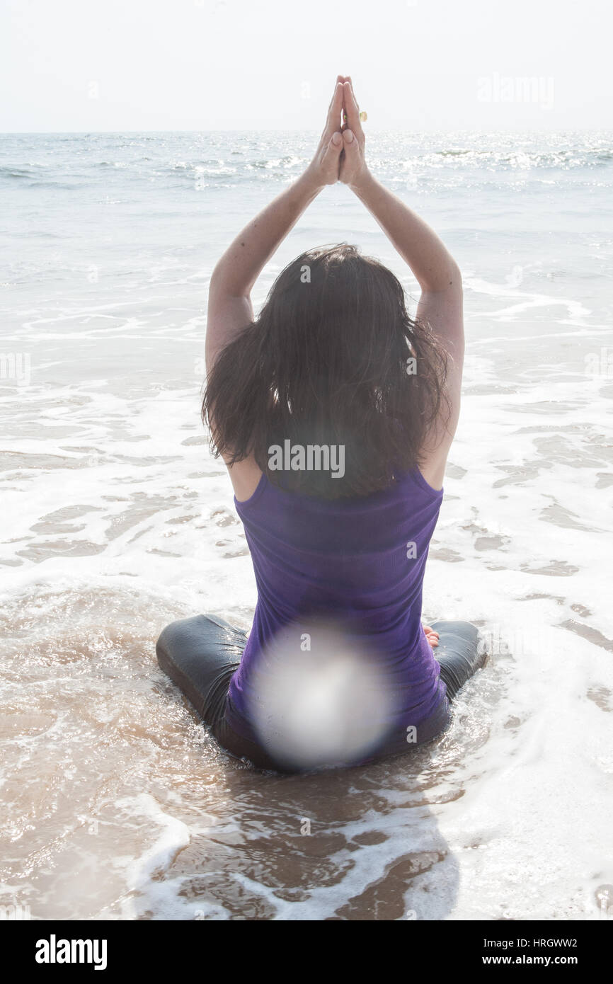 Meditating on a beach in goa hi-res stock photography and images - Alamy