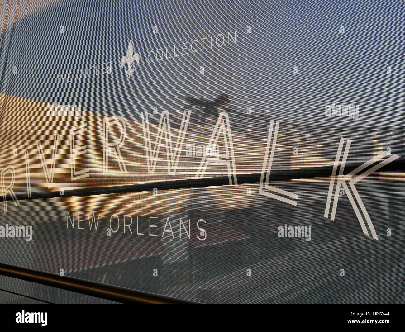 Translucent window shade with New Orleans Riverwalk signage Stock Photo ...