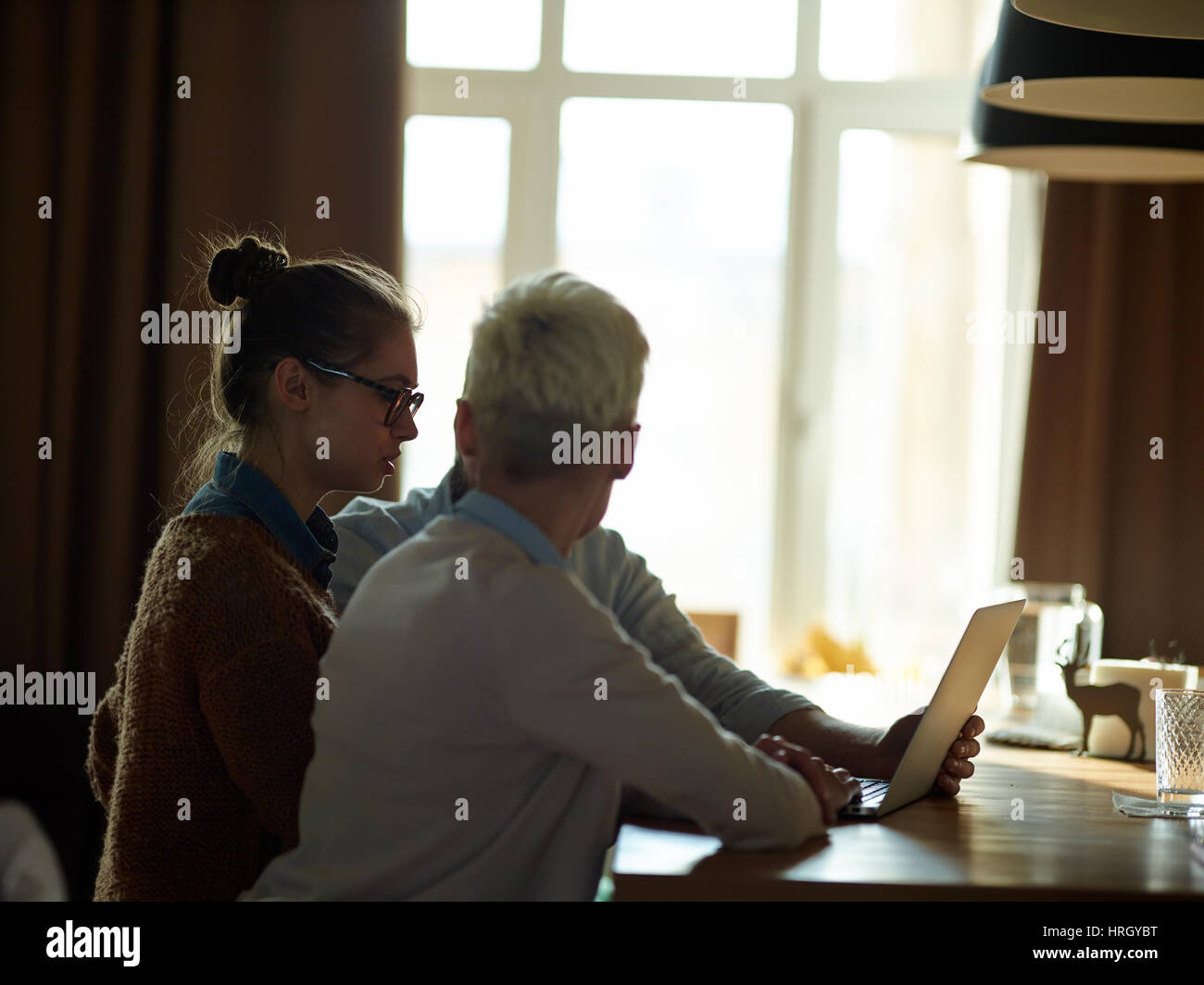 Side view portrait of several creative business people sitting together ...