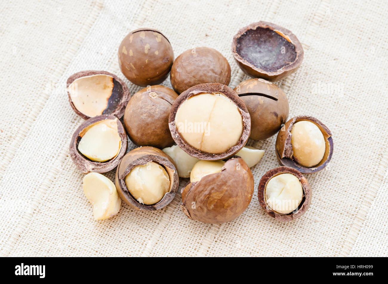 Cracked Macadamia nut on fabric background Stock Photo - Alamy