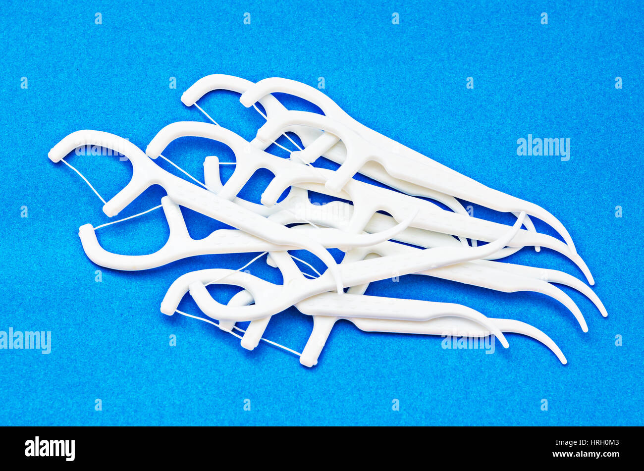 Oral Device Dental white floss on blue background Stock Photo - Alamy