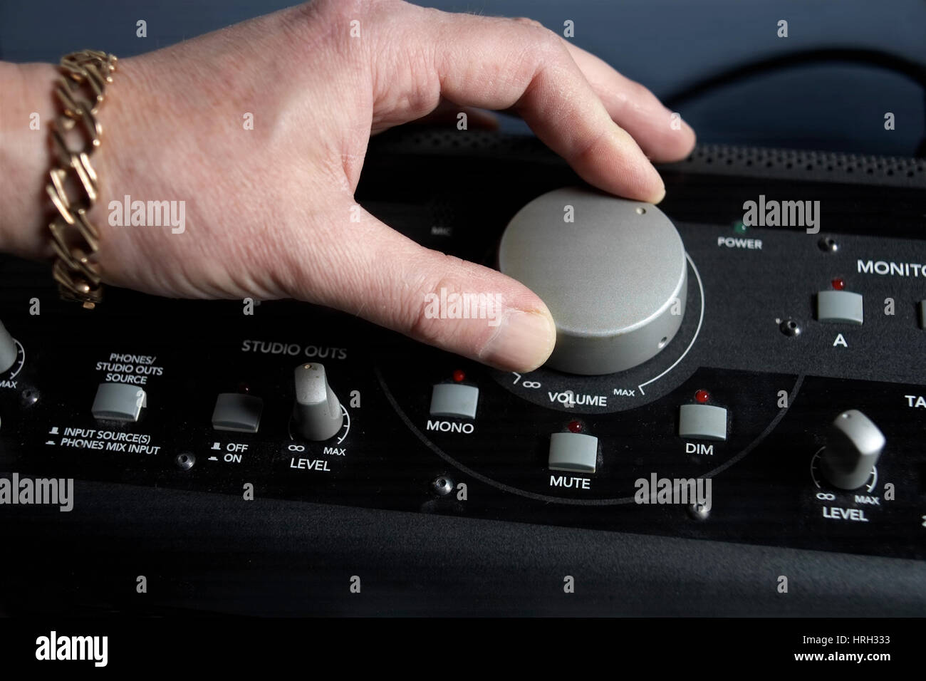 Hand turning volume knob hi-res stock photography and images - Alamy