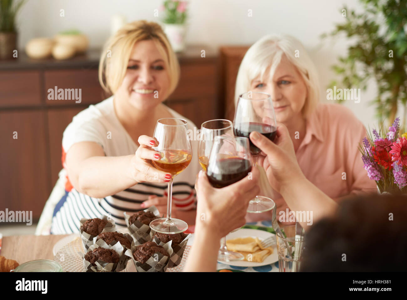 Making celebratory toast for long friendship Stock Photo - Alamy