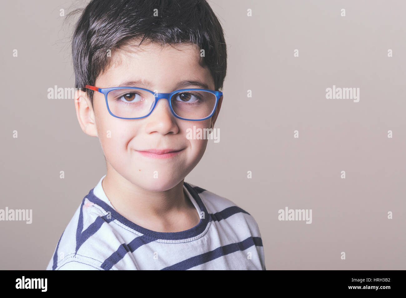 Boy with brown hair and glasses hi-res stock photography and images - Alamy