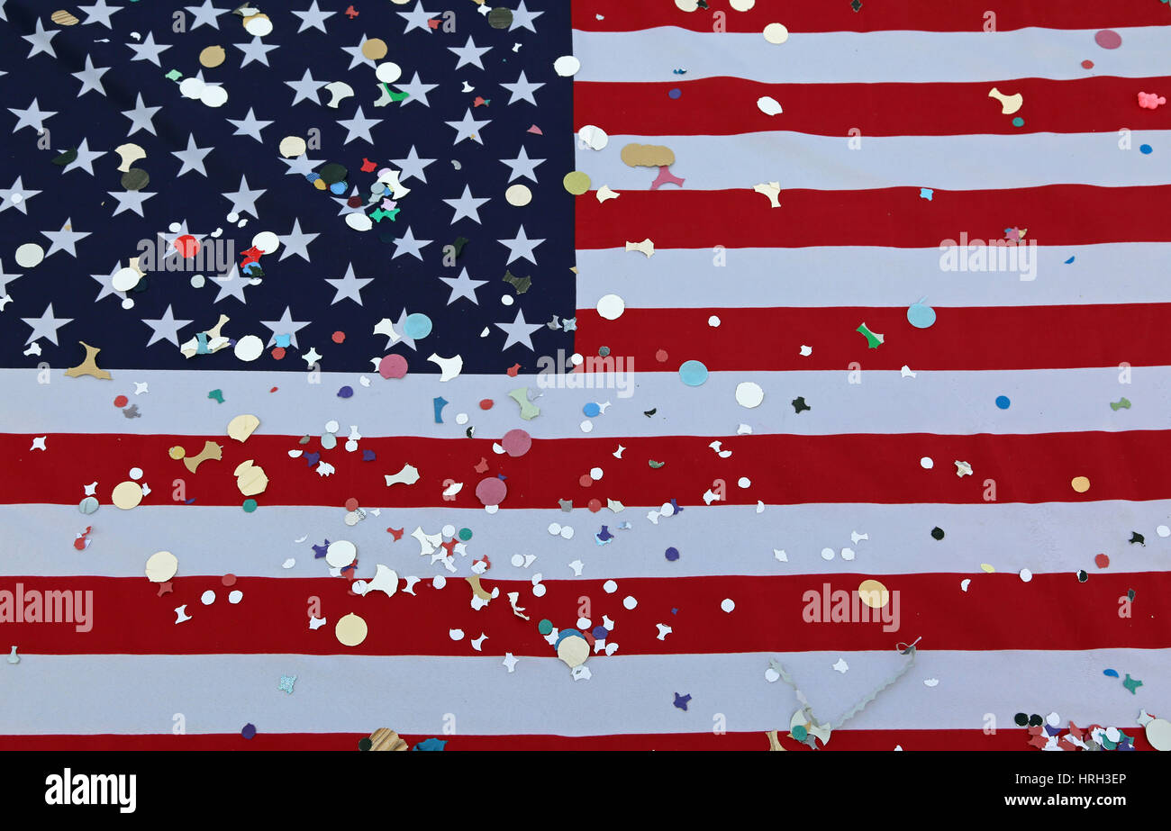 American flag with many colorful confetti during the American holiday ...