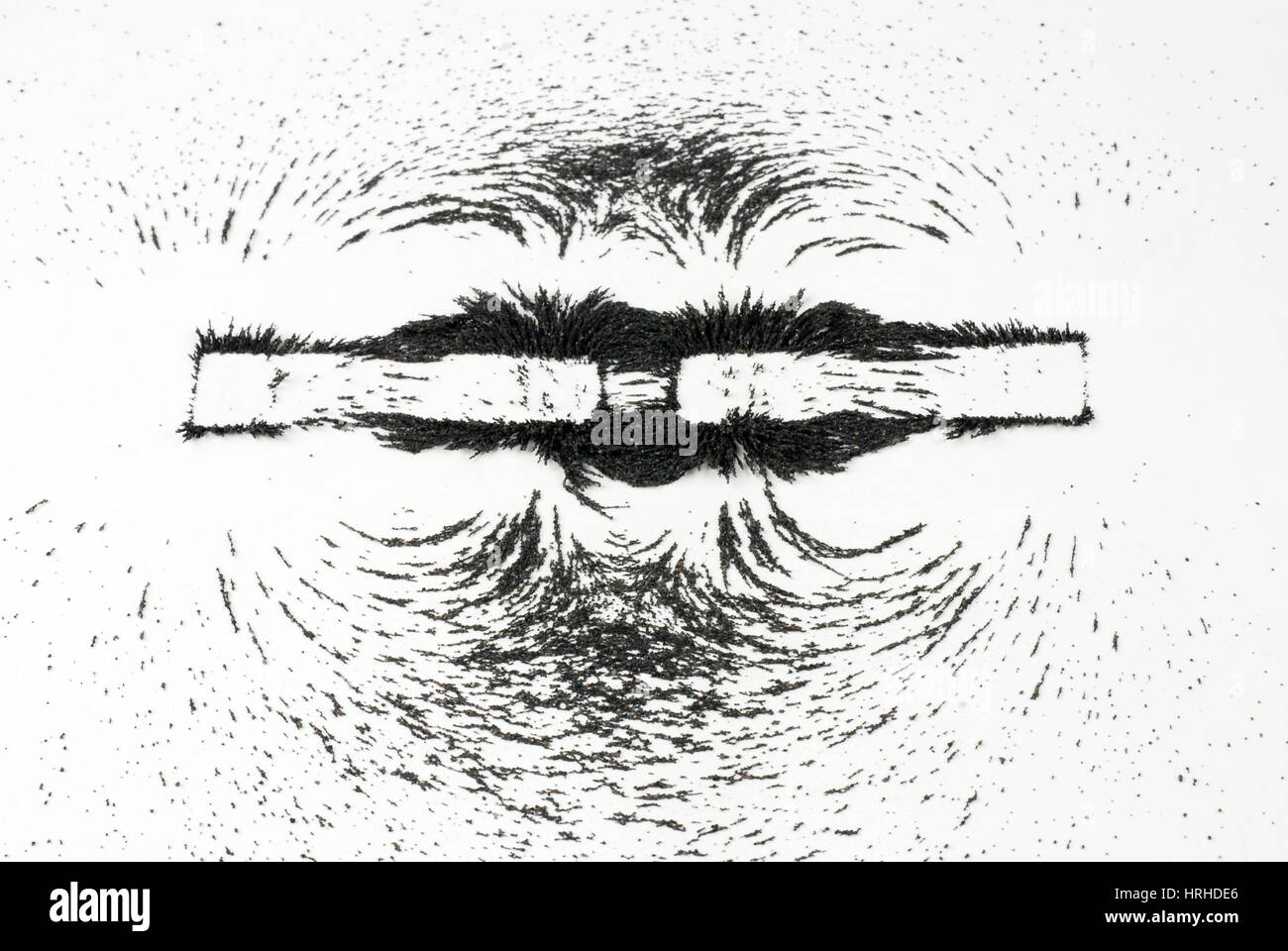 Magnetic attraction iron filings hi-res stock photography and images ...