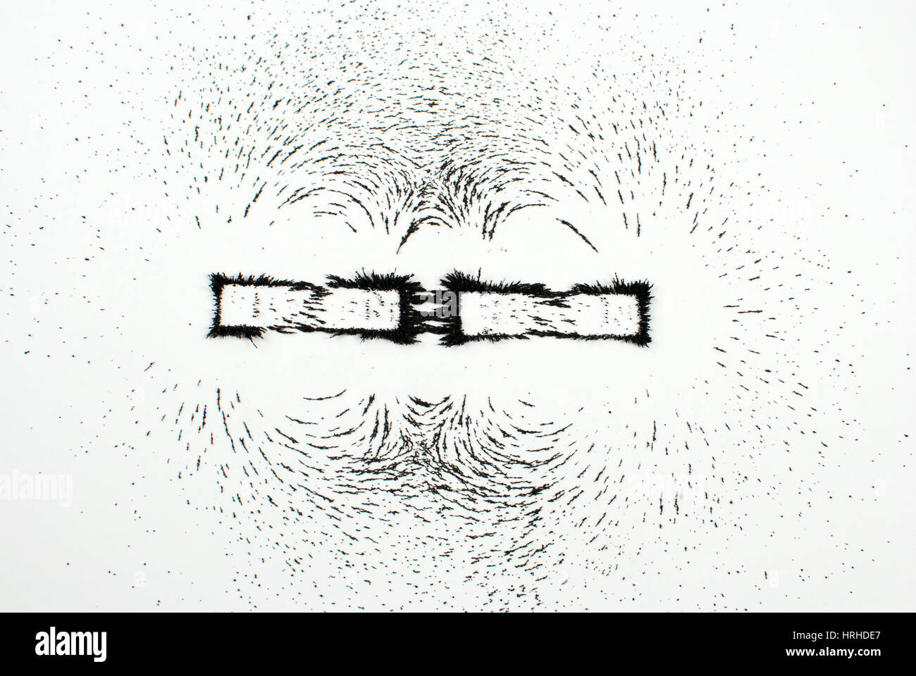 Magnetic attraction iron filings hi-res stock photography and images ...