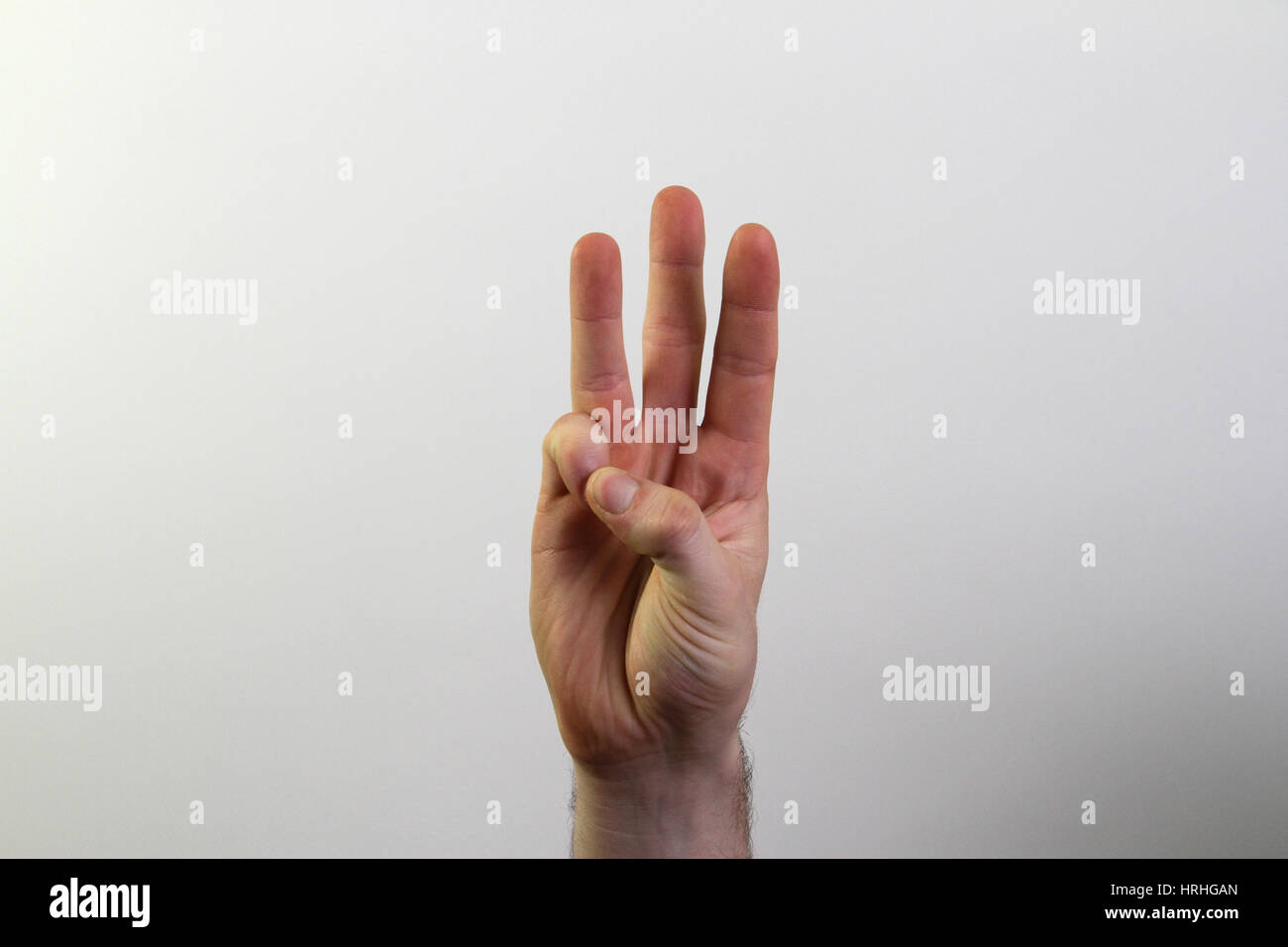 Hand signing number six Stock Photo - Alamy