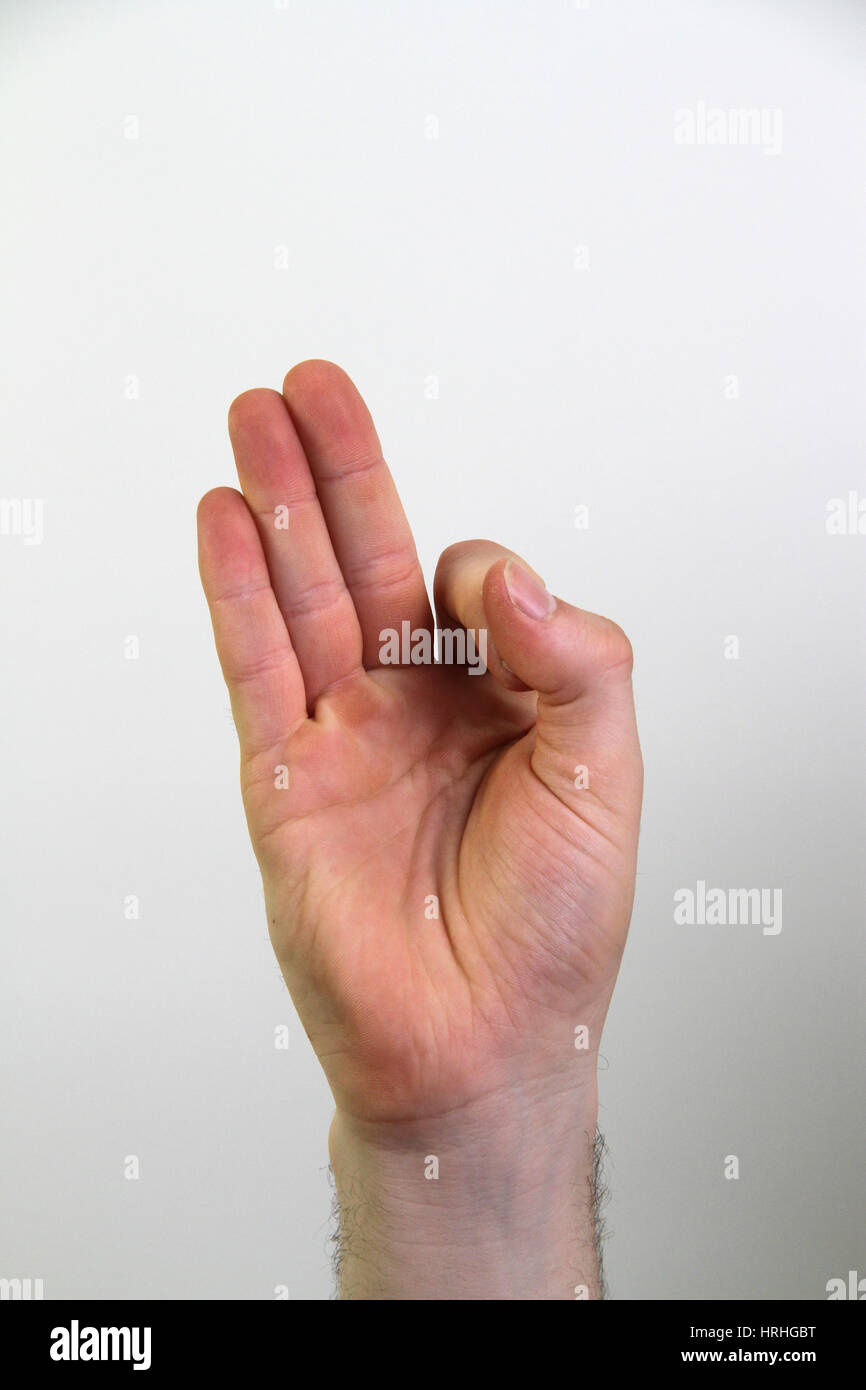 Hand signing number nine Stock Photo - Alamy