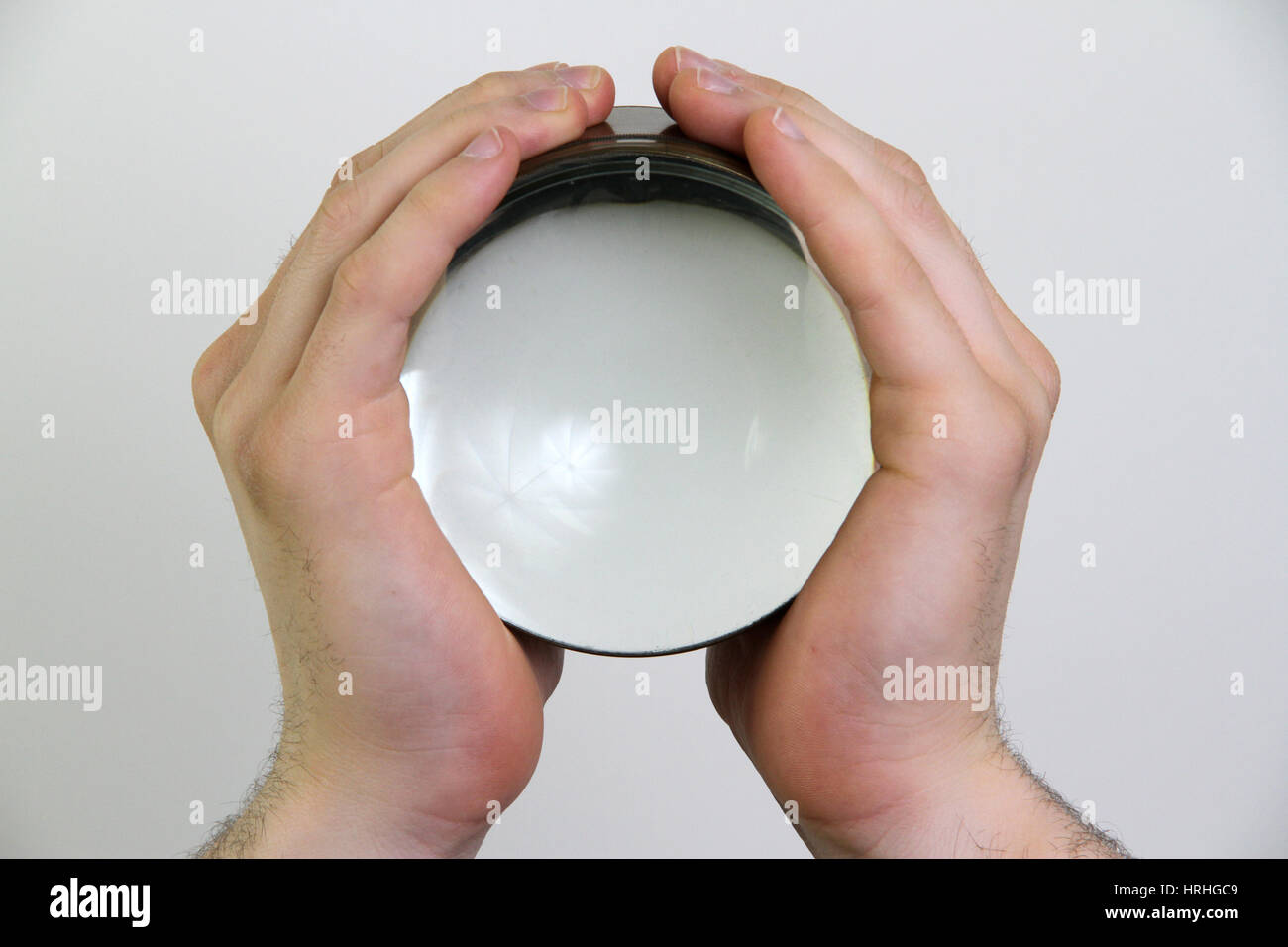 Hands holding a lens Stock Photo - Alamy