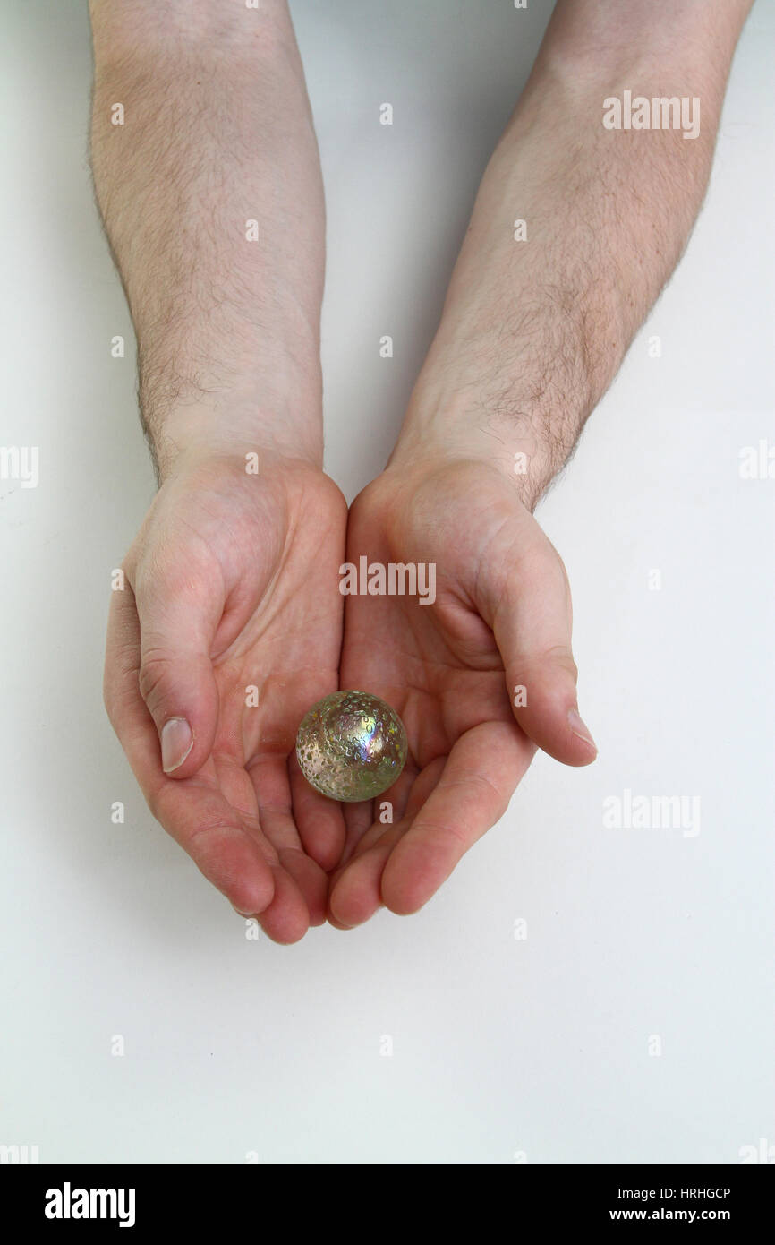 Hand holding marble hi-res stock photography and images - Alamy
