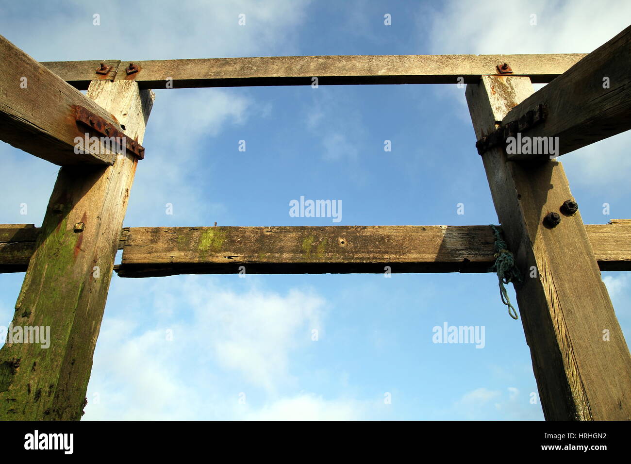 Timber breakwater structure on shingle beach, symmetrical shot against ...