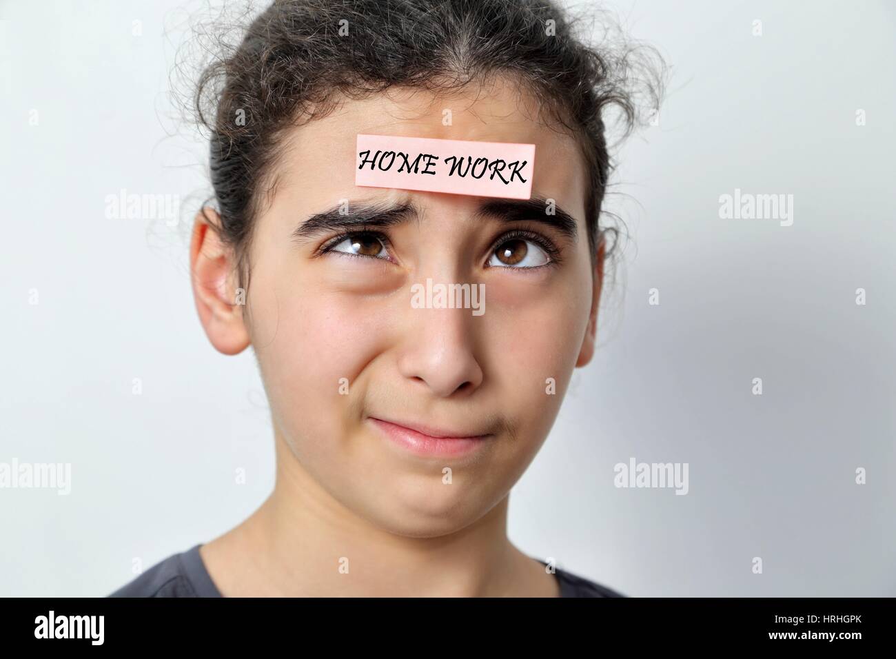 Little girl with memo posts on her forehead, with motivational message ...