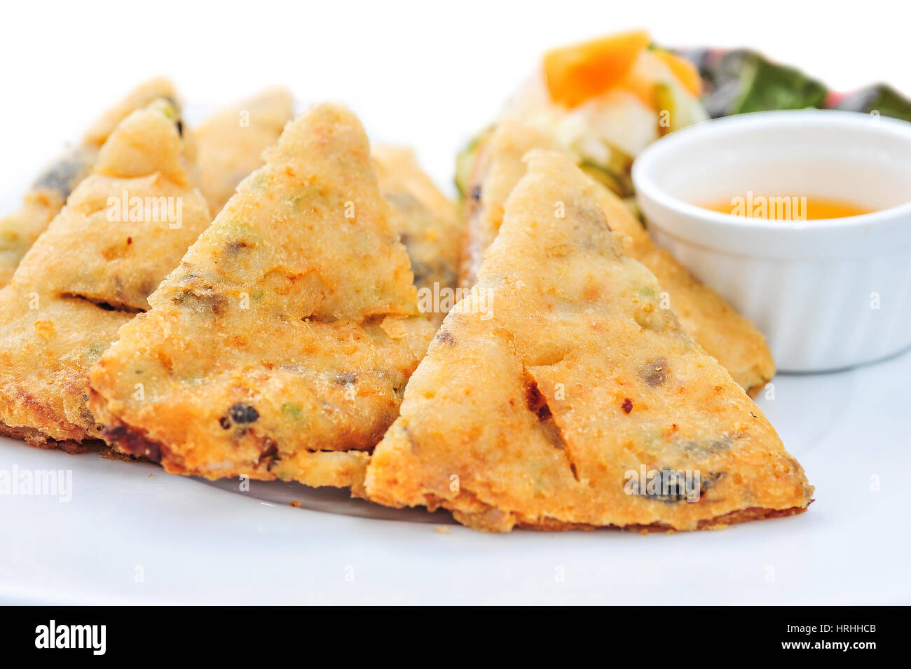 Fried Chinese triangle Traditional Spring rolls food Stock Photo - Alamy