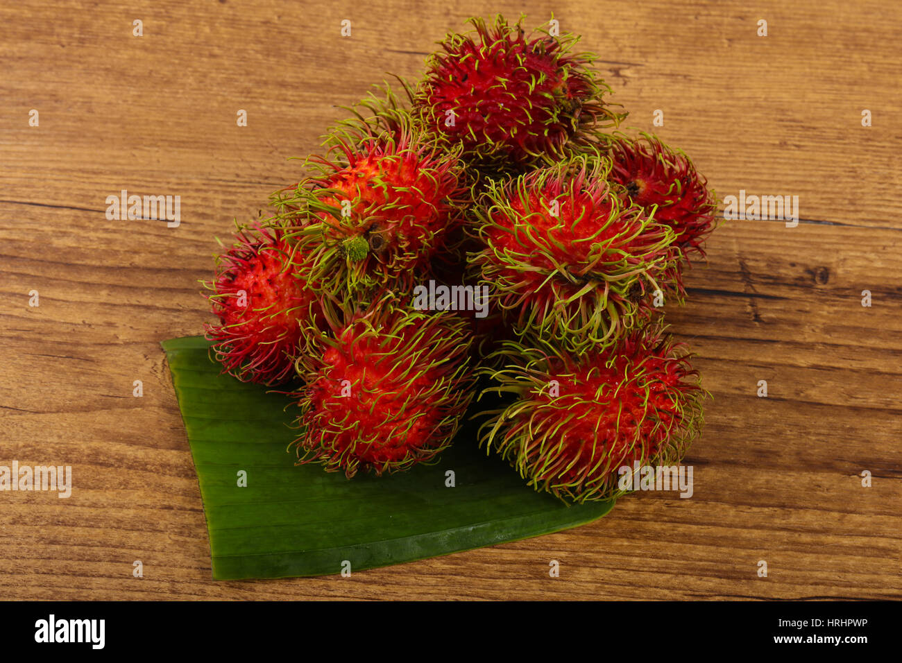 Fresh ripe sweet Rambutan heap - asian fruit Stock Photo - Alamy