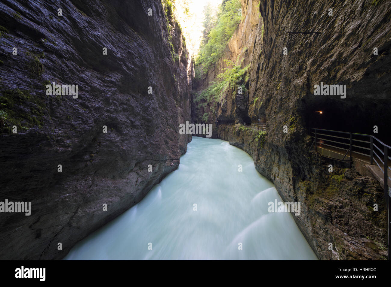 Water of creek flows in the narrow limestone gorge carved by river ...