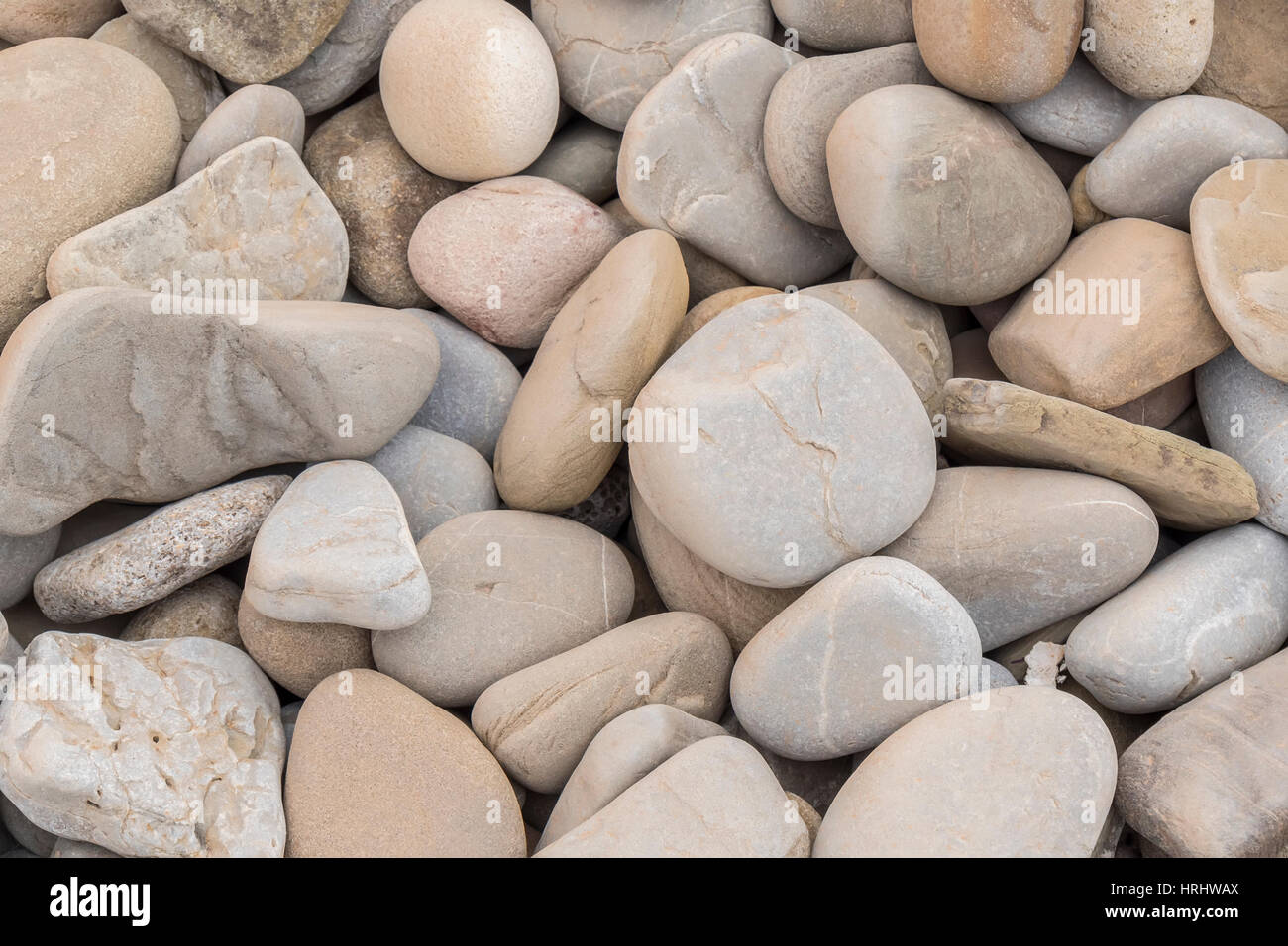 Rounded grey granite rocks beach hi-res stock photography and images ...