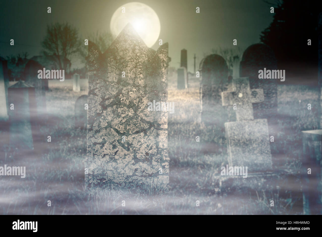 Spooky cemetery at night Stock Photo - Alamy