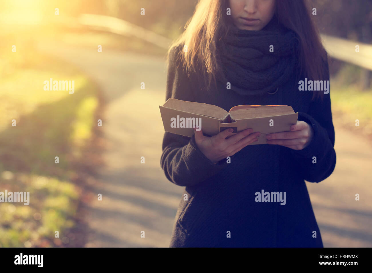 Woman with a book Stock Photo - Alamy