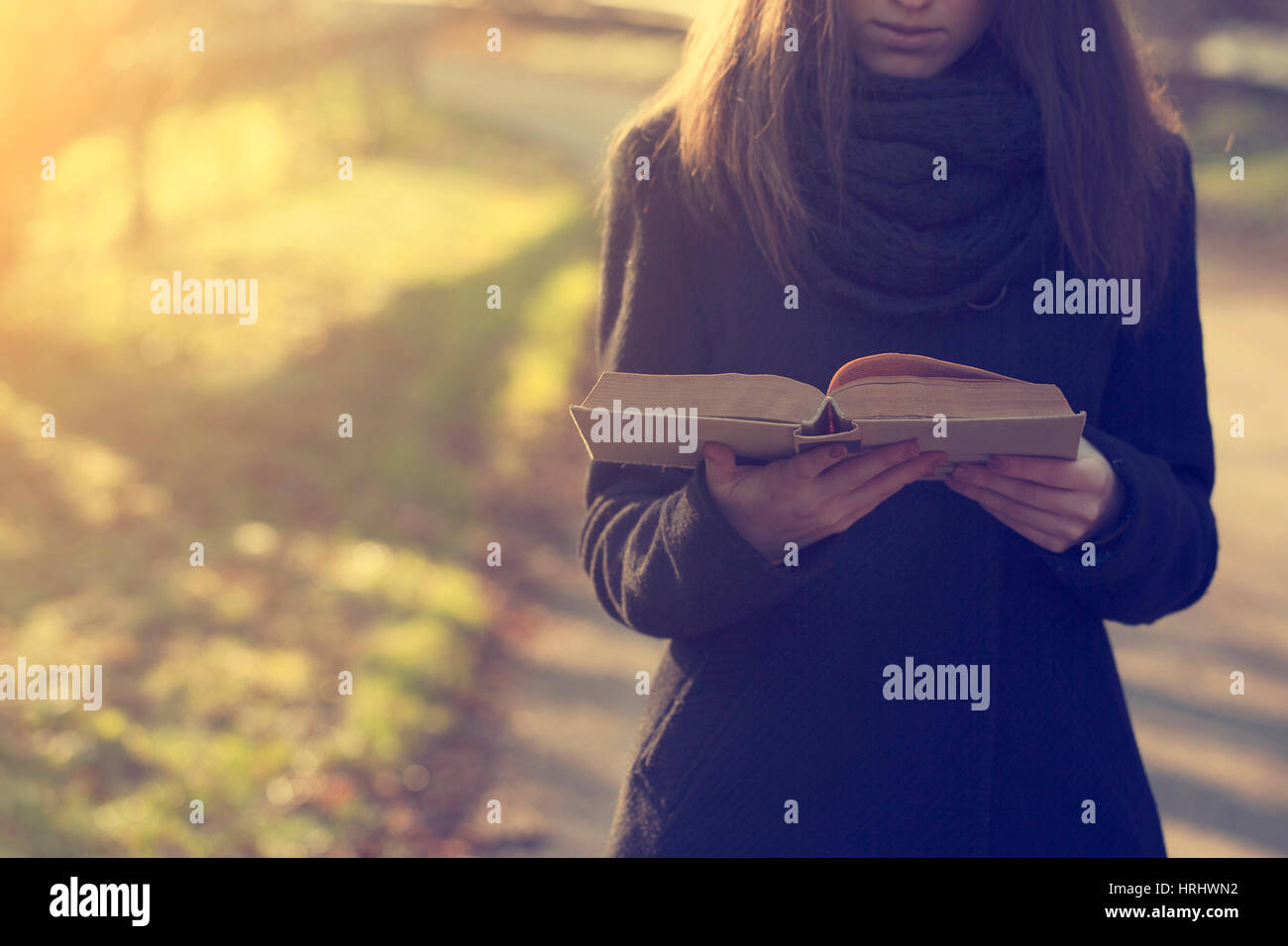 Woman with a book Stock Photo - Alamy