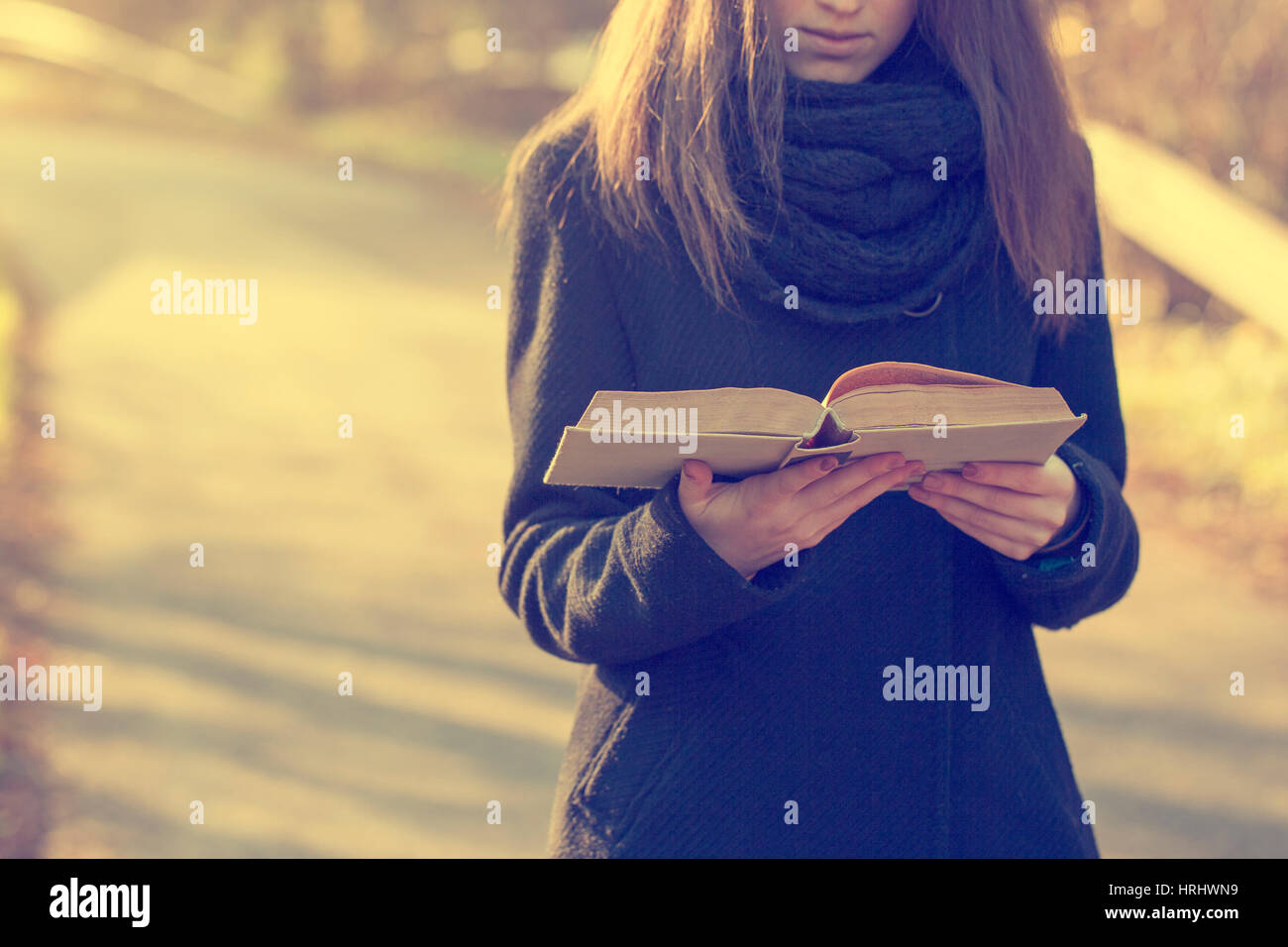 Woman with a book Stock Photo - Alamy