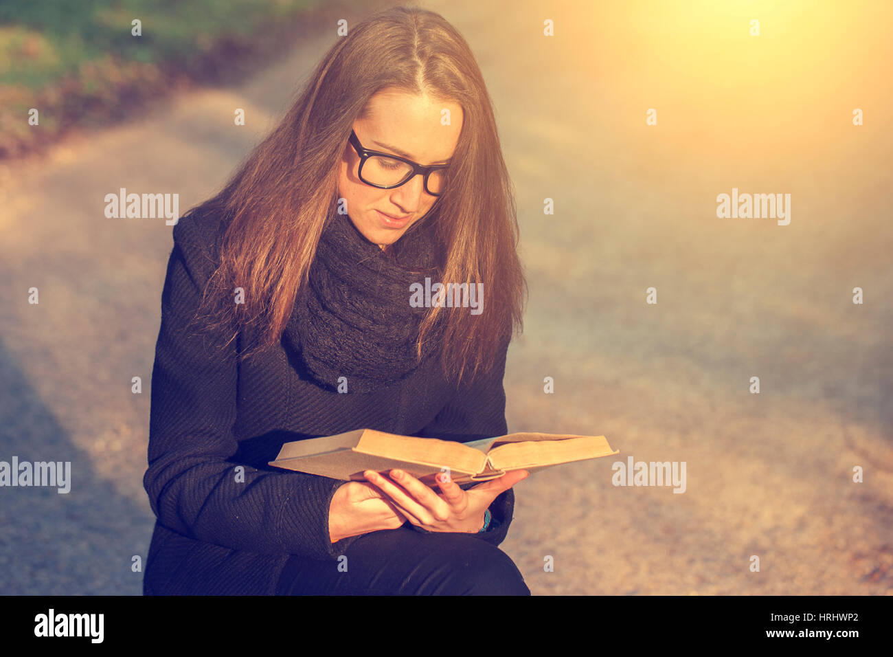 Woman with a book Stock Photo - Alamy