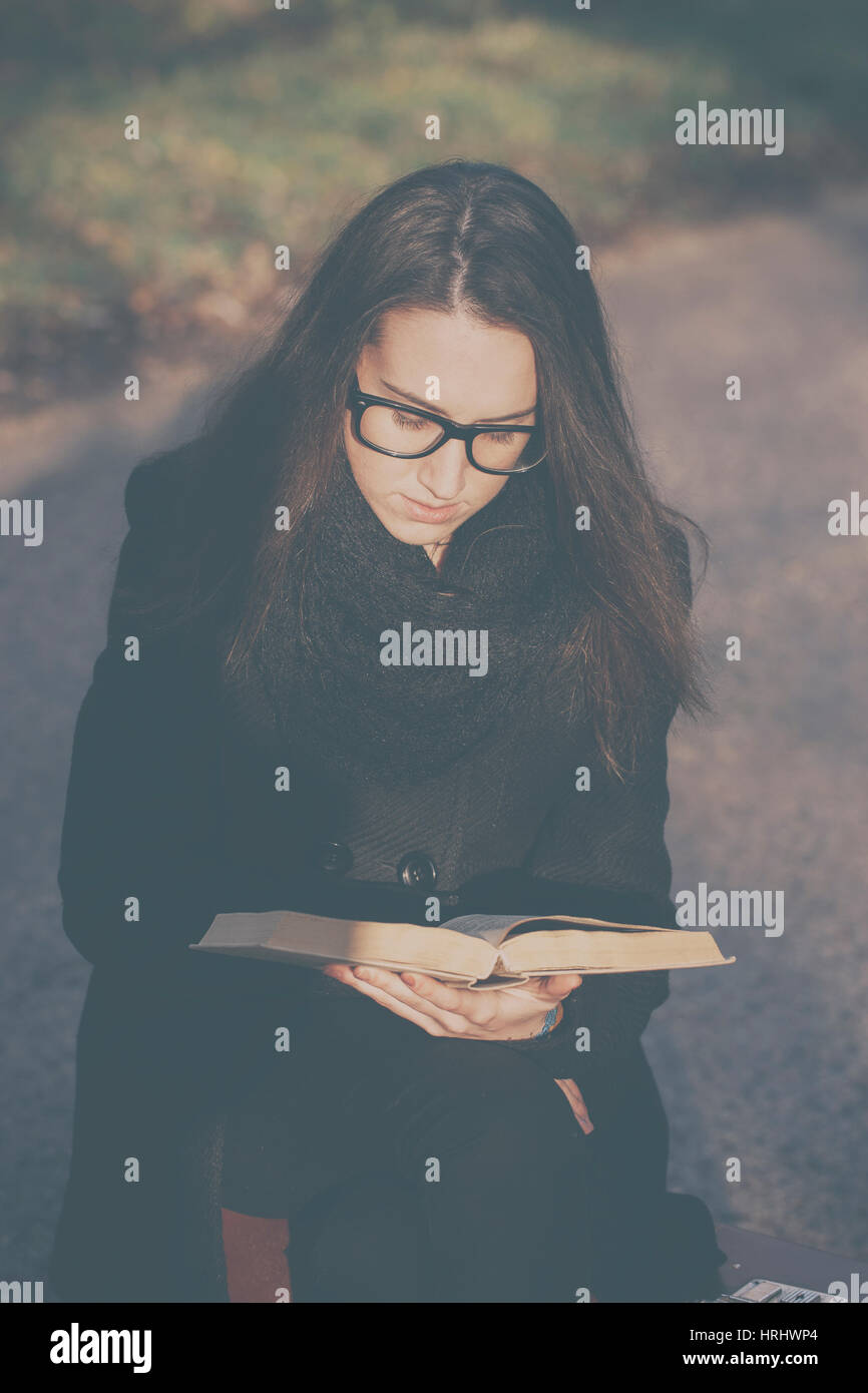 Woman with a book Stock Photo - Alamy