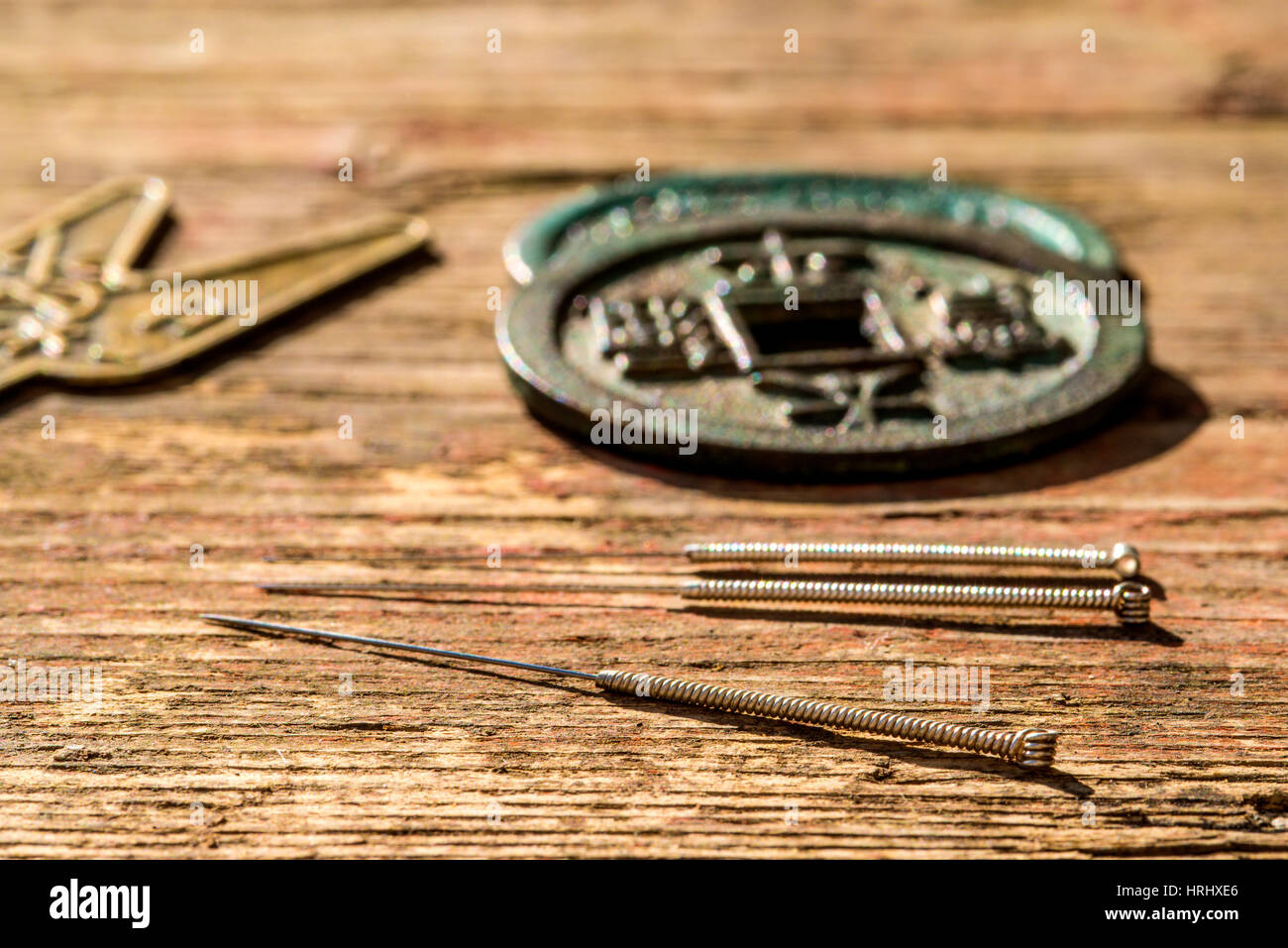 Acupuncture needles antique chinese coin hi-res stock photography and ...