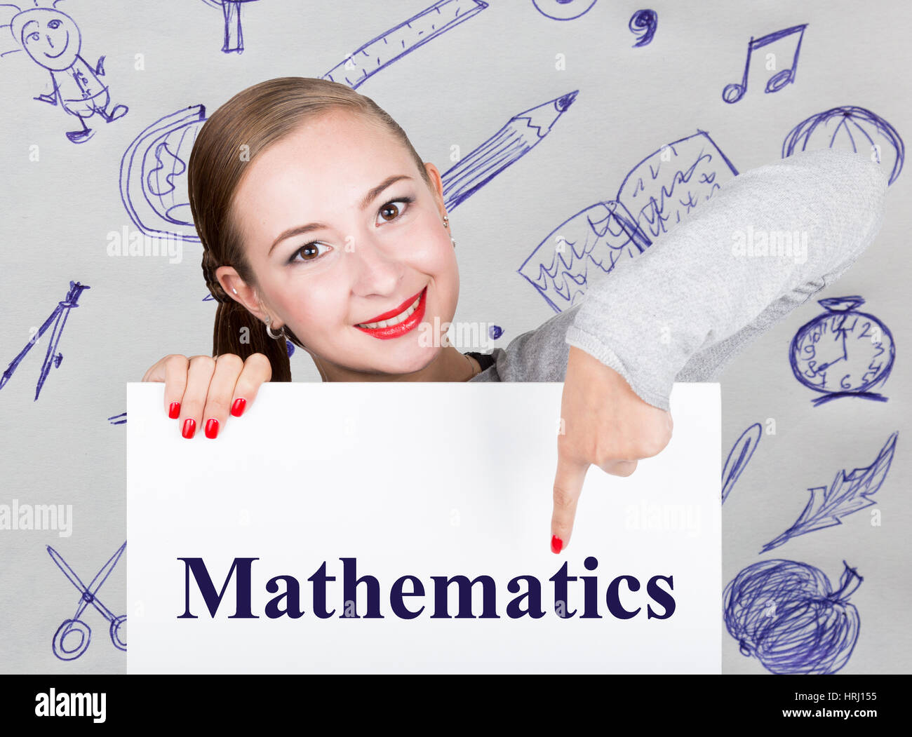 Young woman holding whiteboard with writing word: mathematics ...