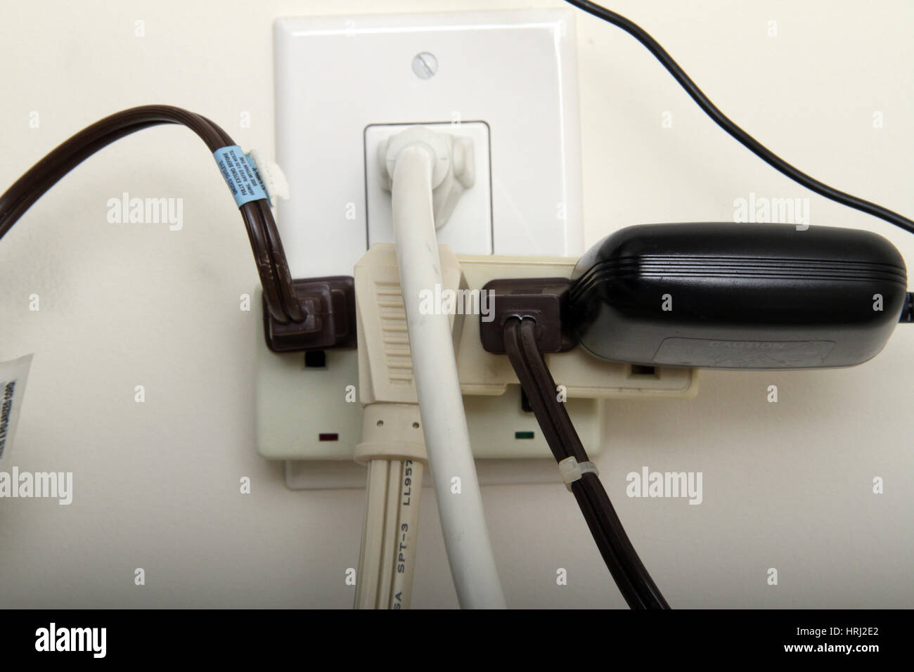 Overloaded Electrical Outlet Stock Photo - Alamy