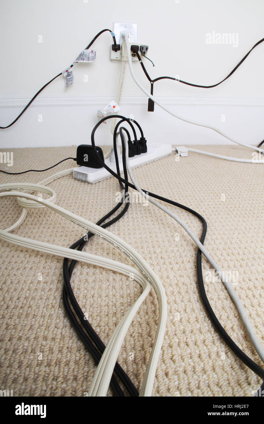Overloaded Electrical Outlet Stock Photo - Alamy