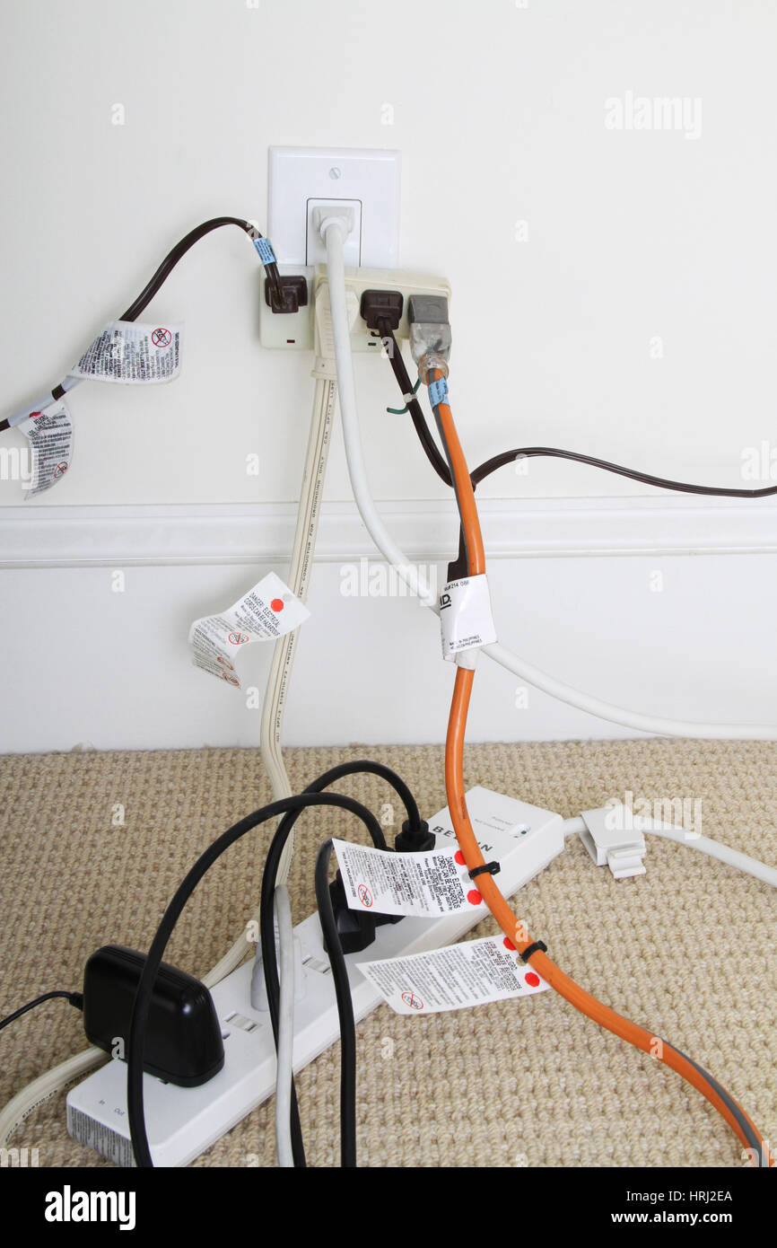 Overloaded Electrical Outlet Stock Photo - Alamy