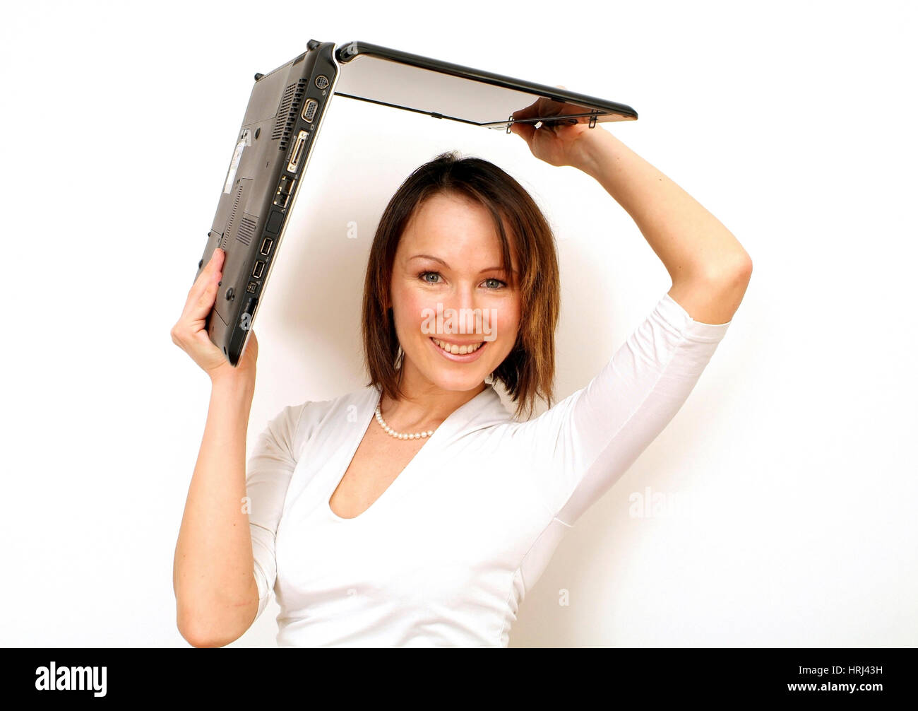 Junge Frau mit Notebook ?ber dem Kopf - Young woman with laptop Stock ...