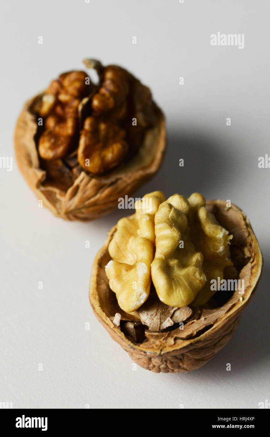 An organic and a regular walnut Stock Photo - Alamy