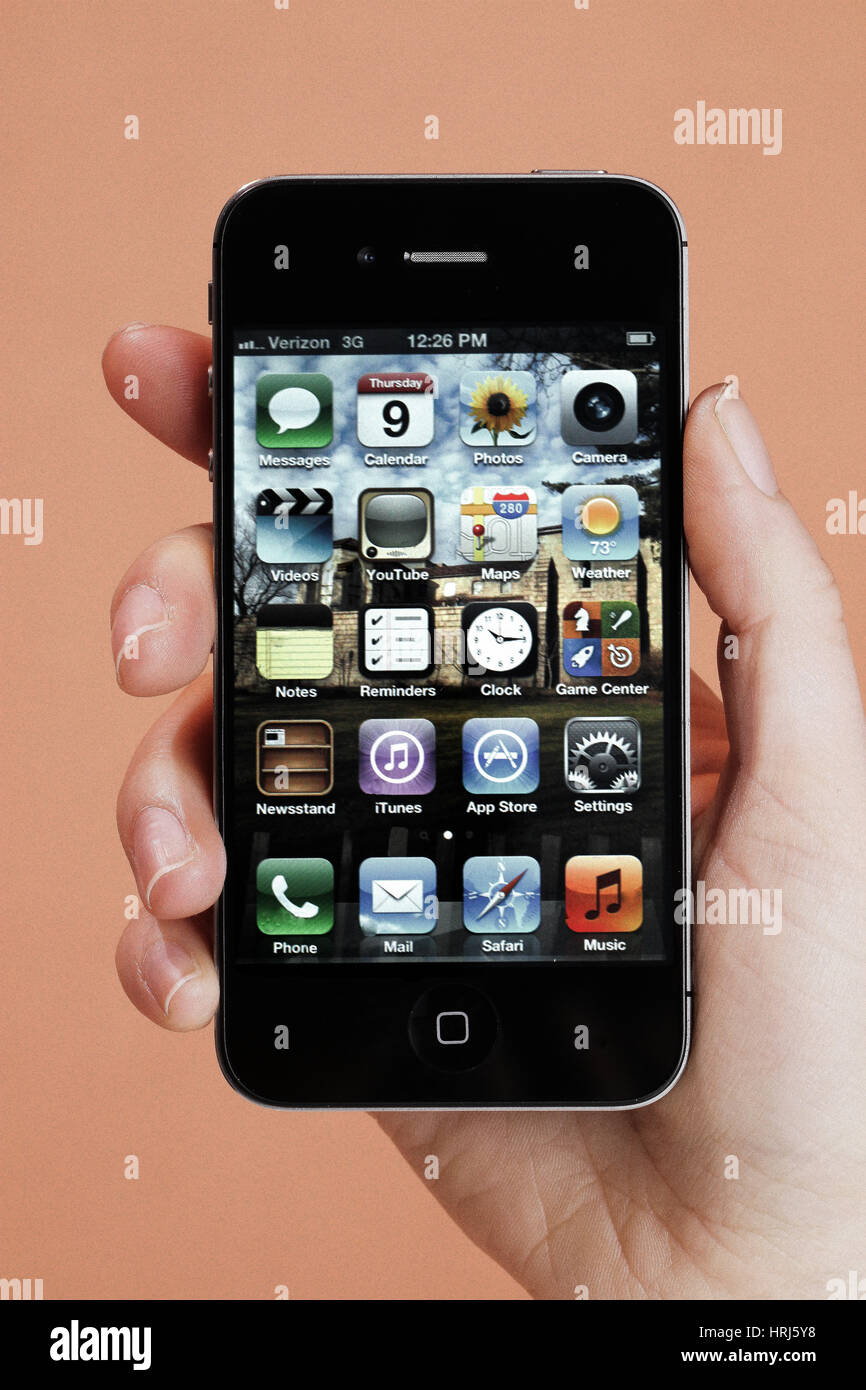 Hand holding an iphone Stock Photo - Alamy